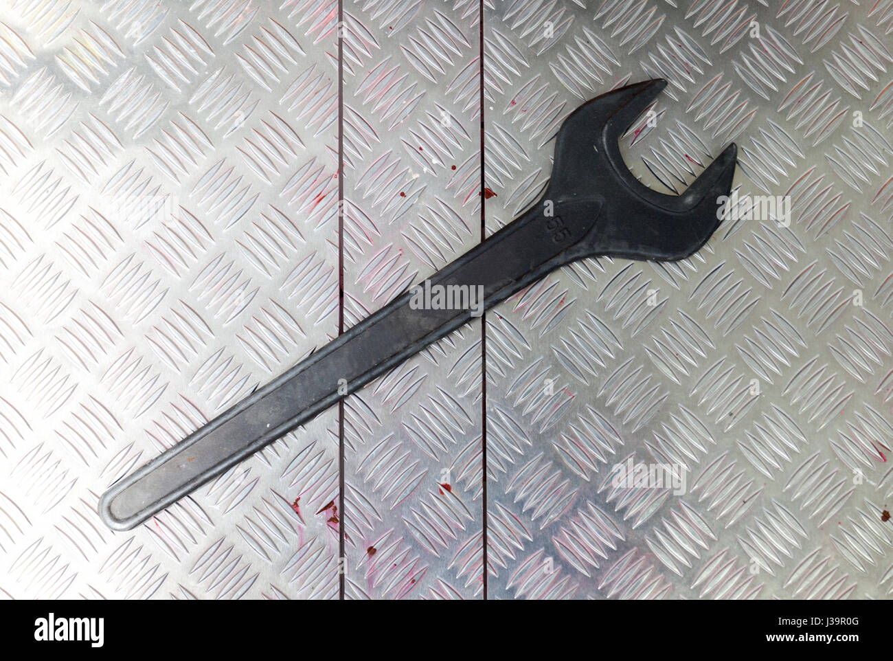 large metal key screw, on metal plate Stock Photo - Alamy