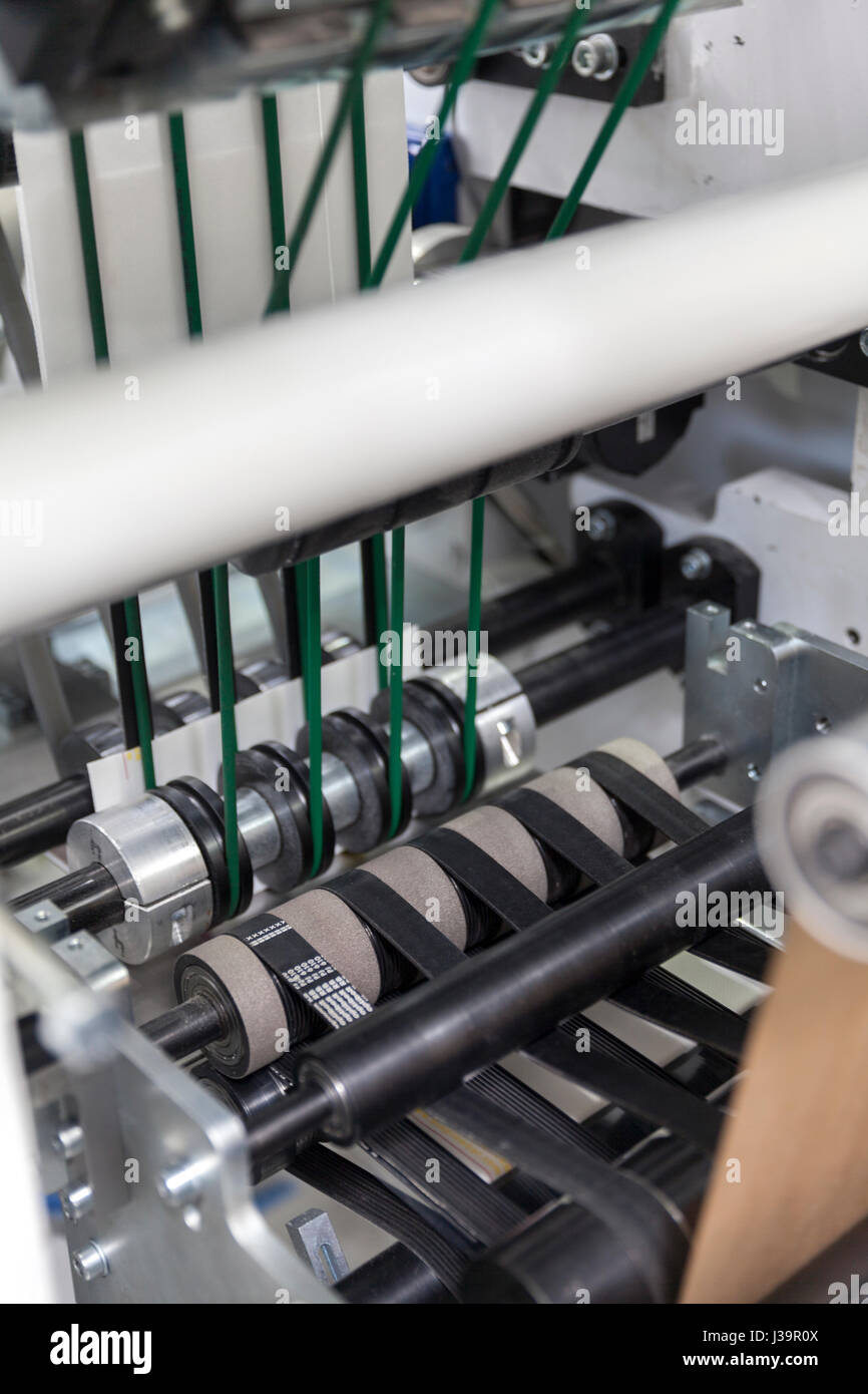 paper rolling machine, white paper on roll Stock Photo - Alamy
