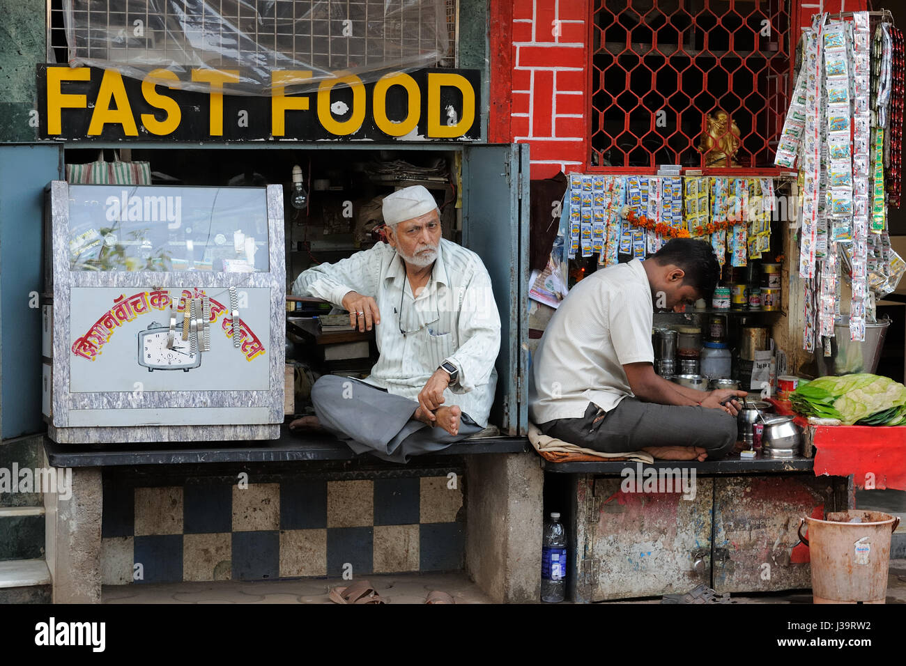 MUMBAI, INDIA - MARCH 25: Fast food on the hindu bustling street in ...