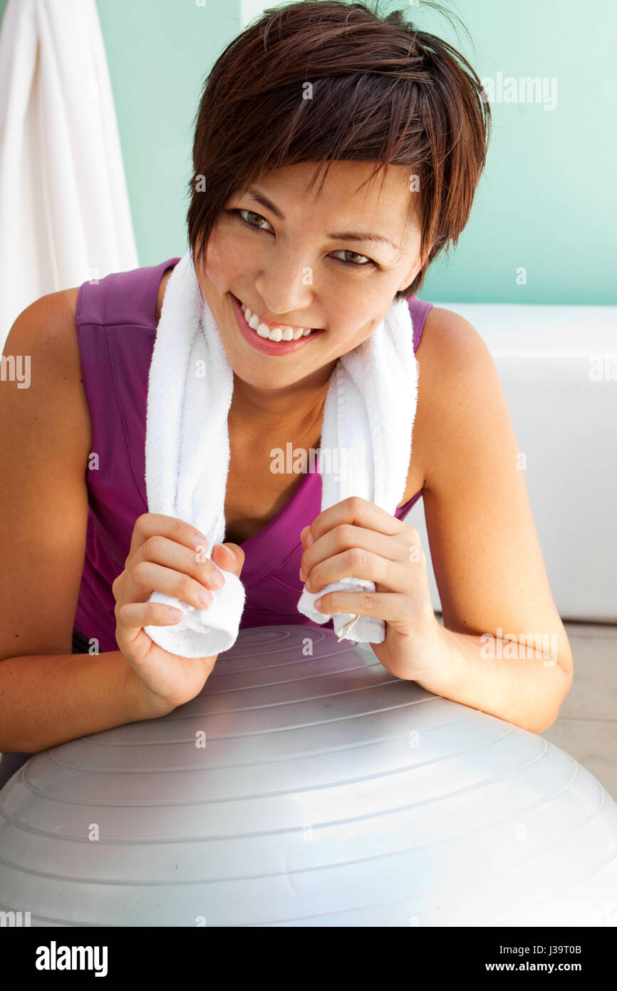 Asian woman exercising at the gym Stock Photo - Alamy