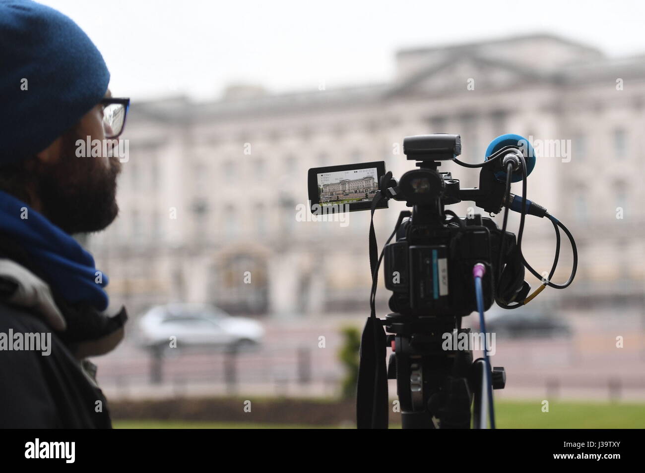 A cameraman outside Buckingham Palace in London. The Duke of Edinburgh ...