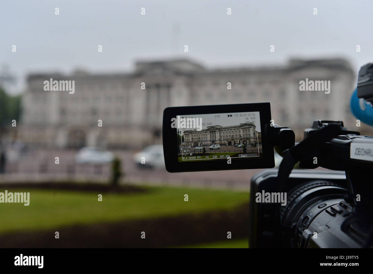 A cameraman outside Buckingham Palace in London. The Duke of Edinburgh ...
