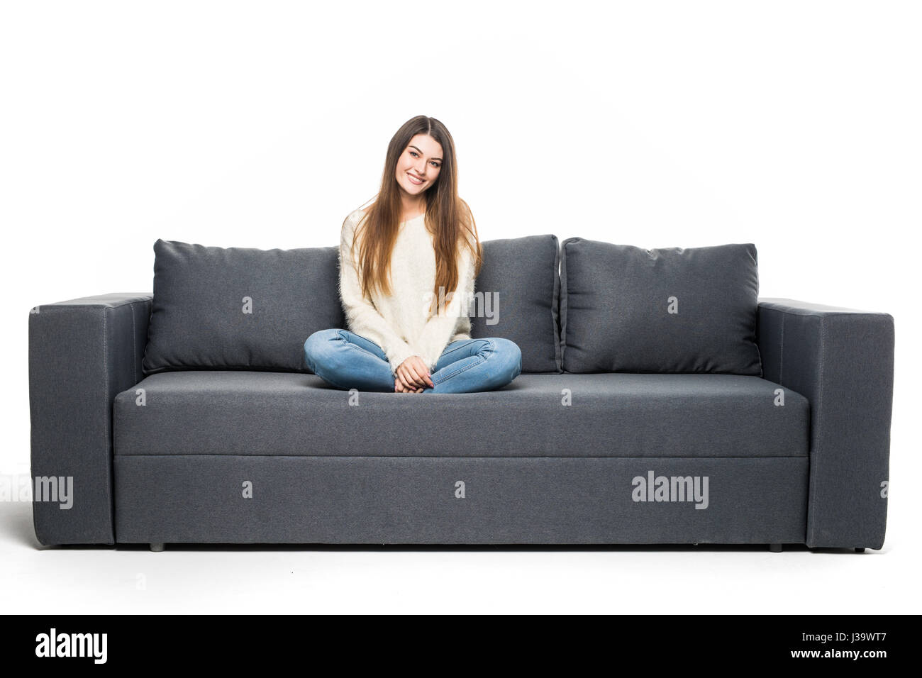 Woman reclining on couch Cut Out Stock Images & Pictures - Alamy