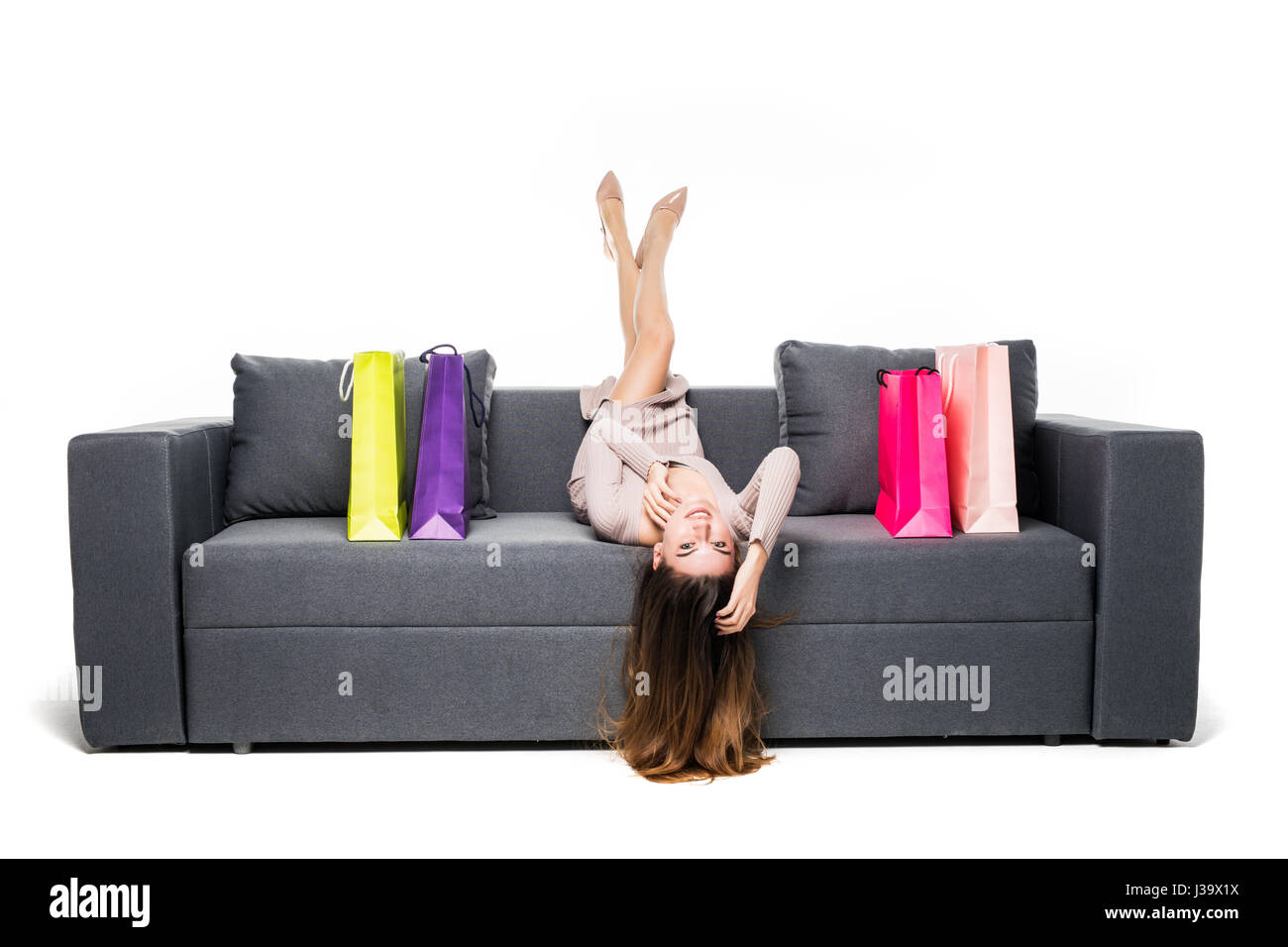 Girl sitting on couch Cut Out Stock Images & Pictures - Alamy