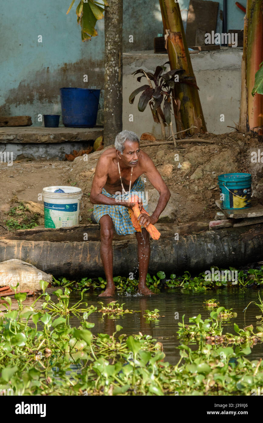 Indian man washing clothes on hi-res stock photography and images - Alamy