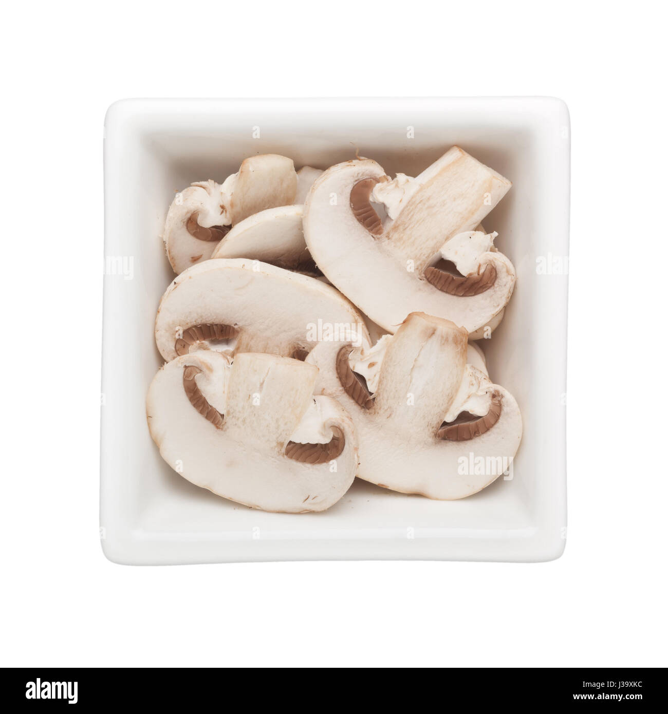 Sliced white button mushroom in a square bowl isolated on white ...
