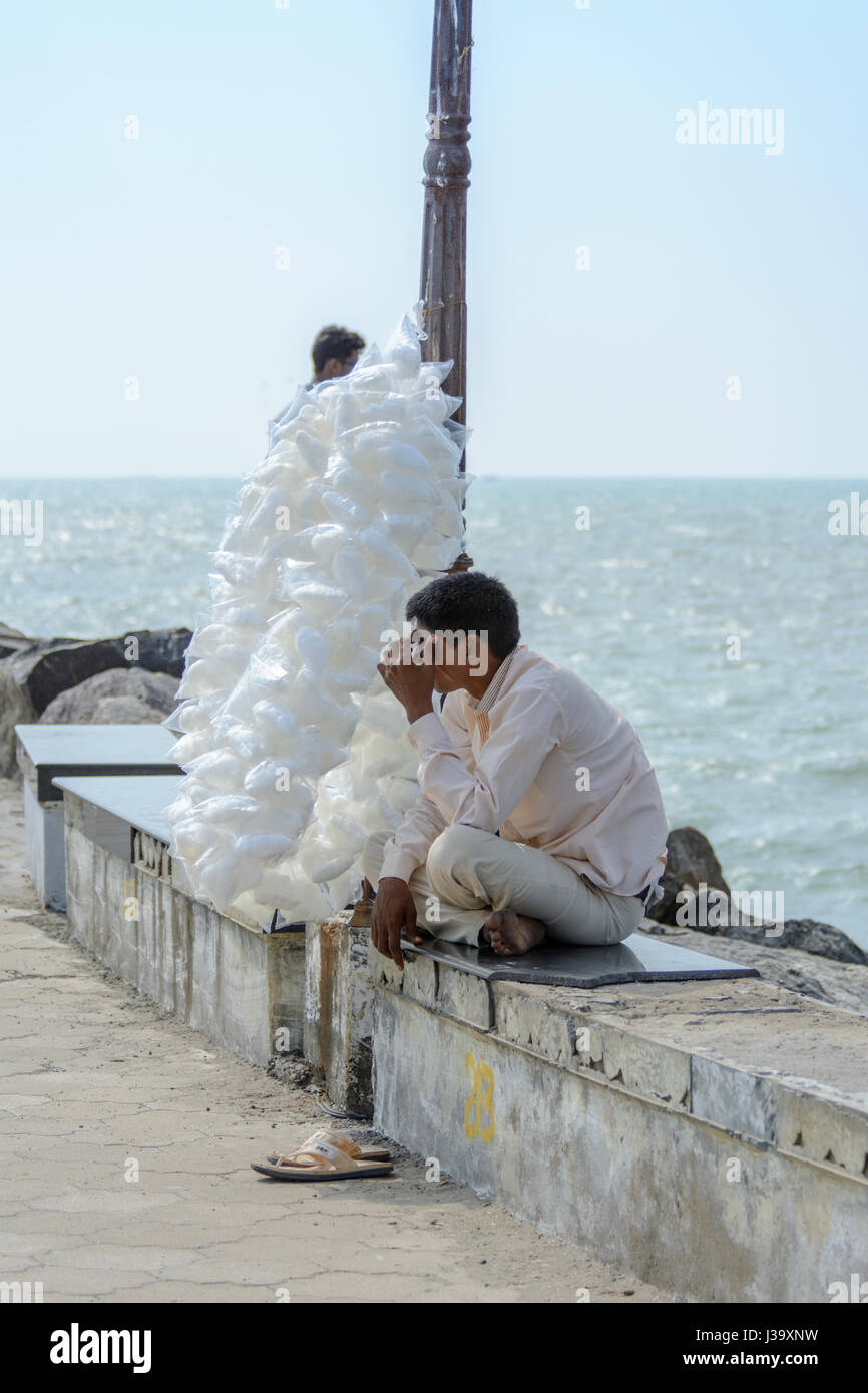 A candyfloss seller sits on the pier at Beypore beach (Beypur ...
