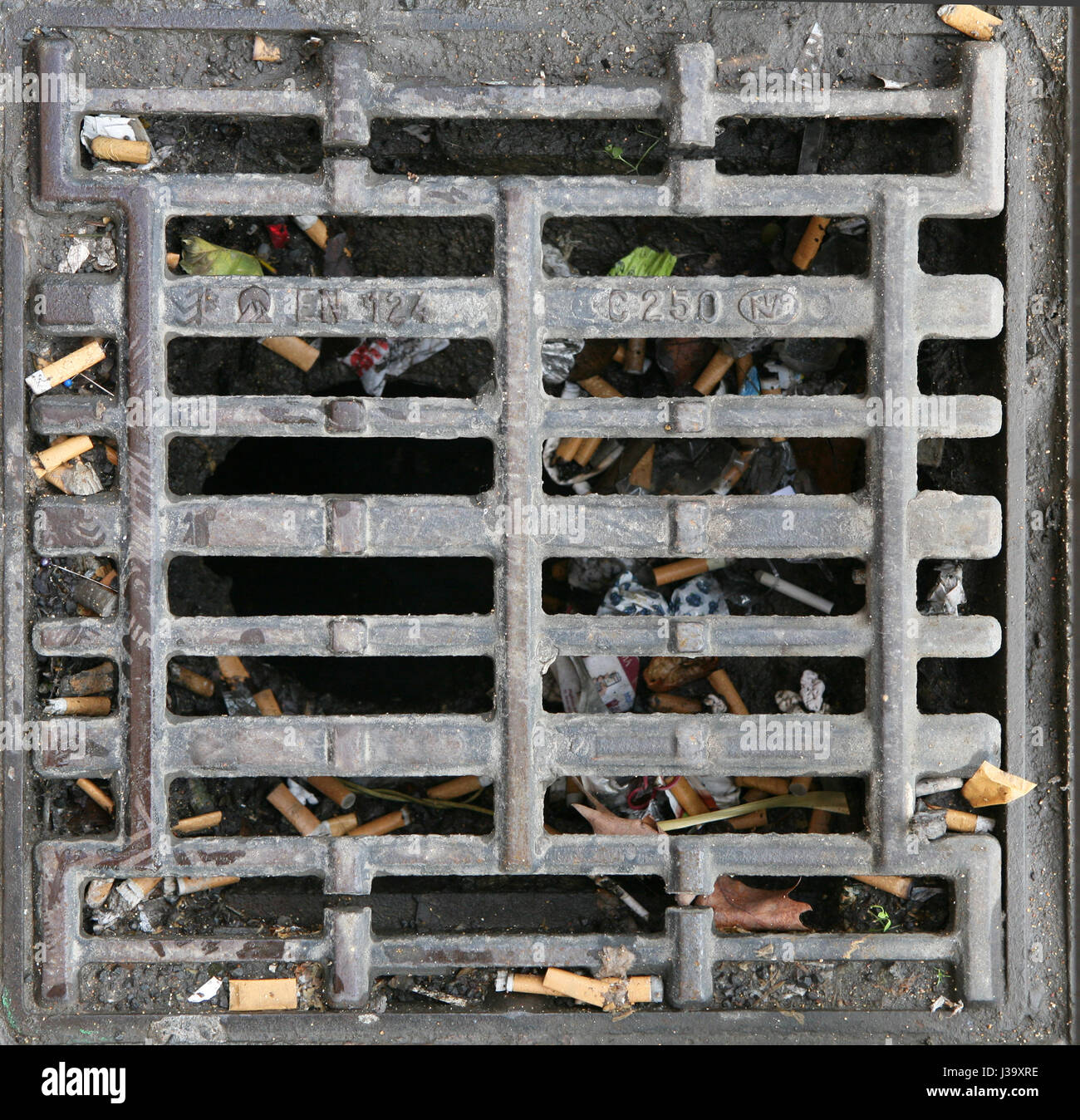 Drain grates with light background texture Stock Photo - Alamy