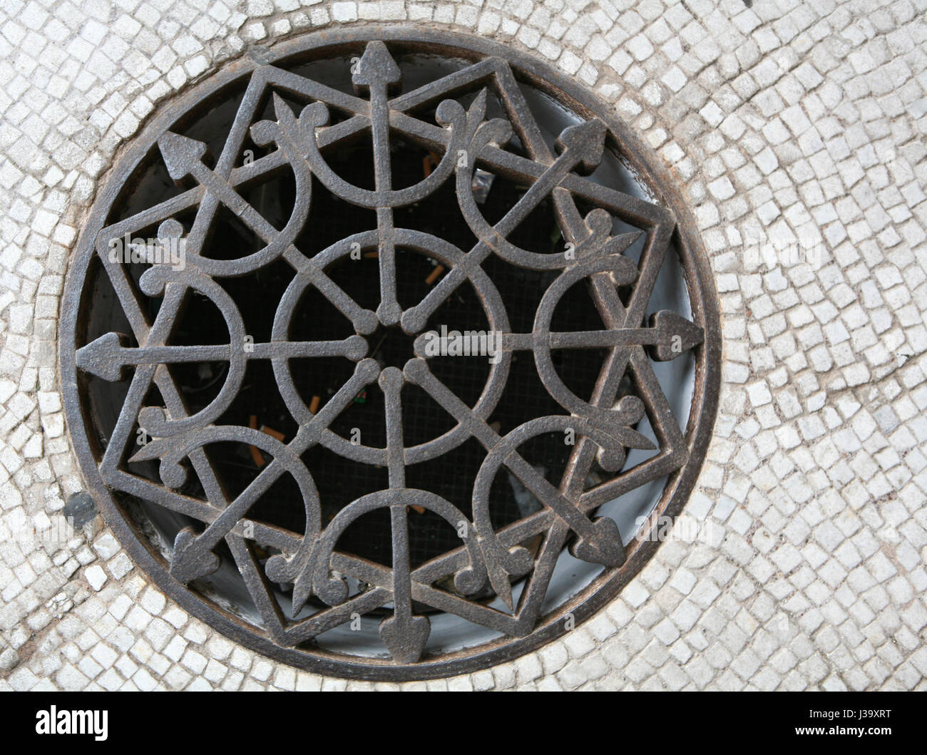 Drain grates with light background texture Stock Photo - Alamy