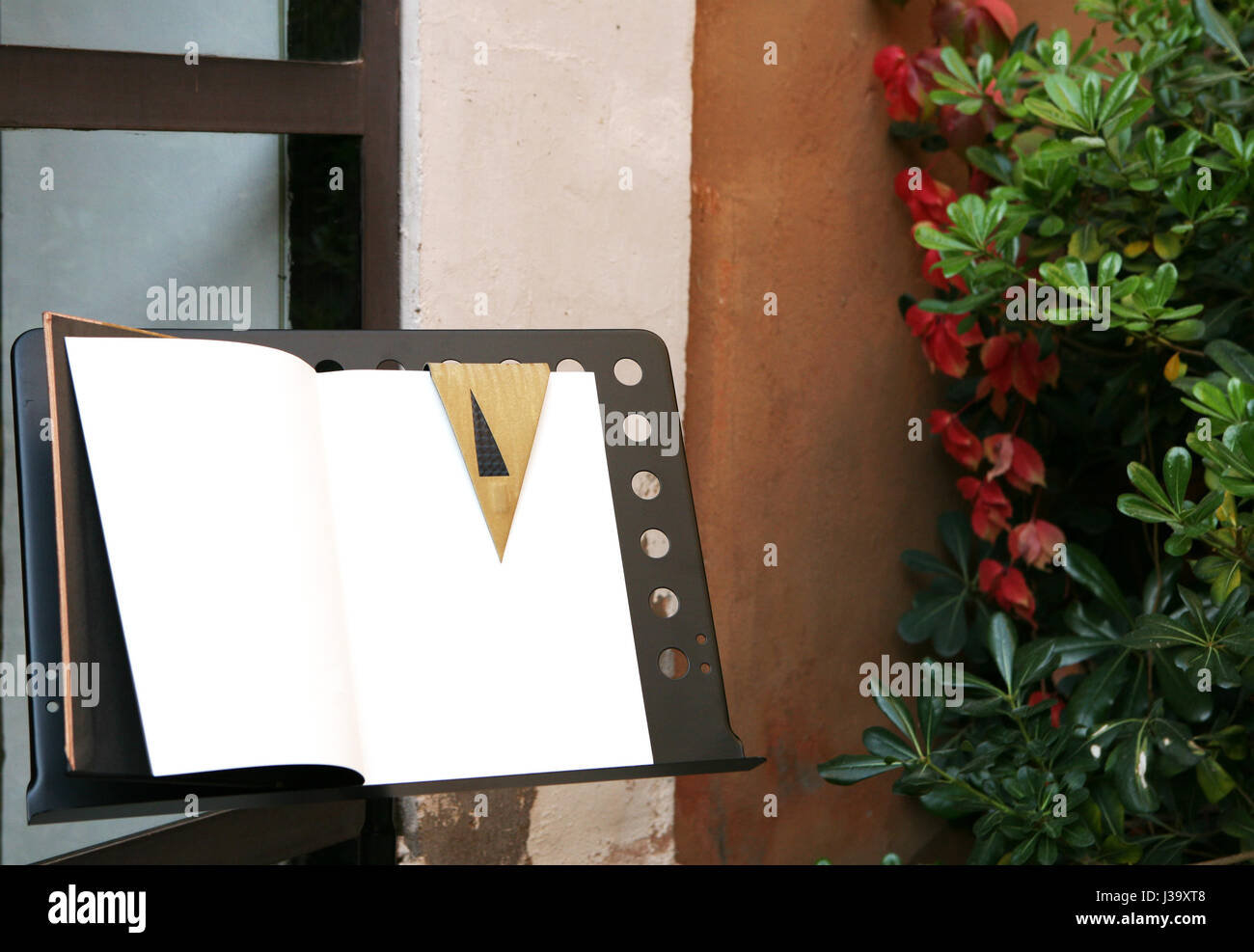 Open guests book on a lectern Stock Photo - Alamy