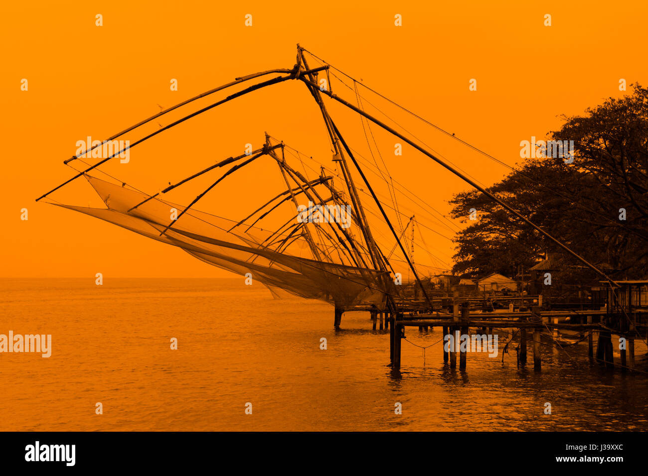 Chinese fishing nets sunset fort cochin hi-res stock photography and ...
