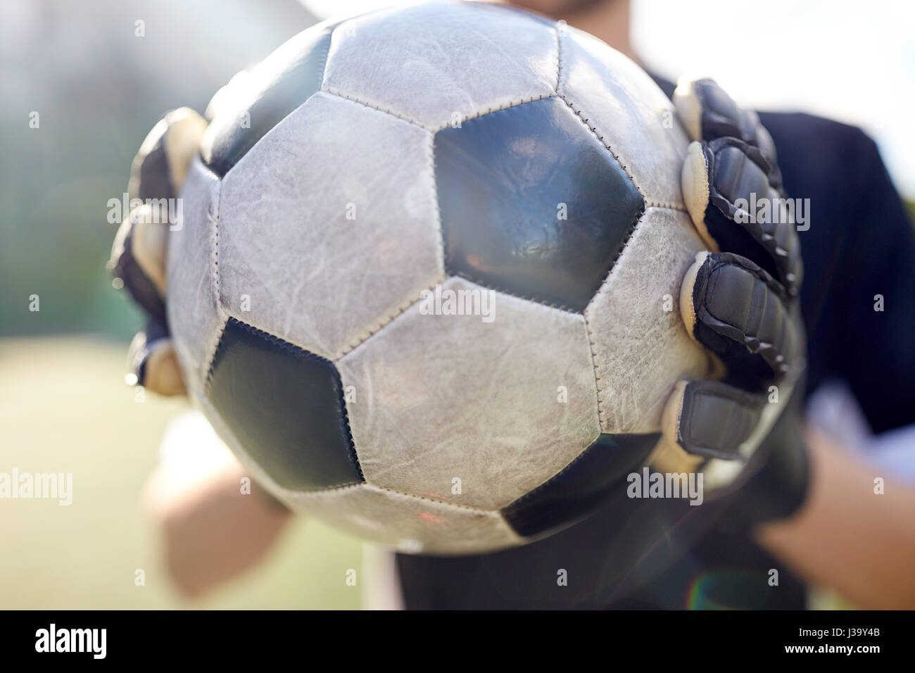 close up of goalkeeper with ball playing football Stock Photo - Alamy