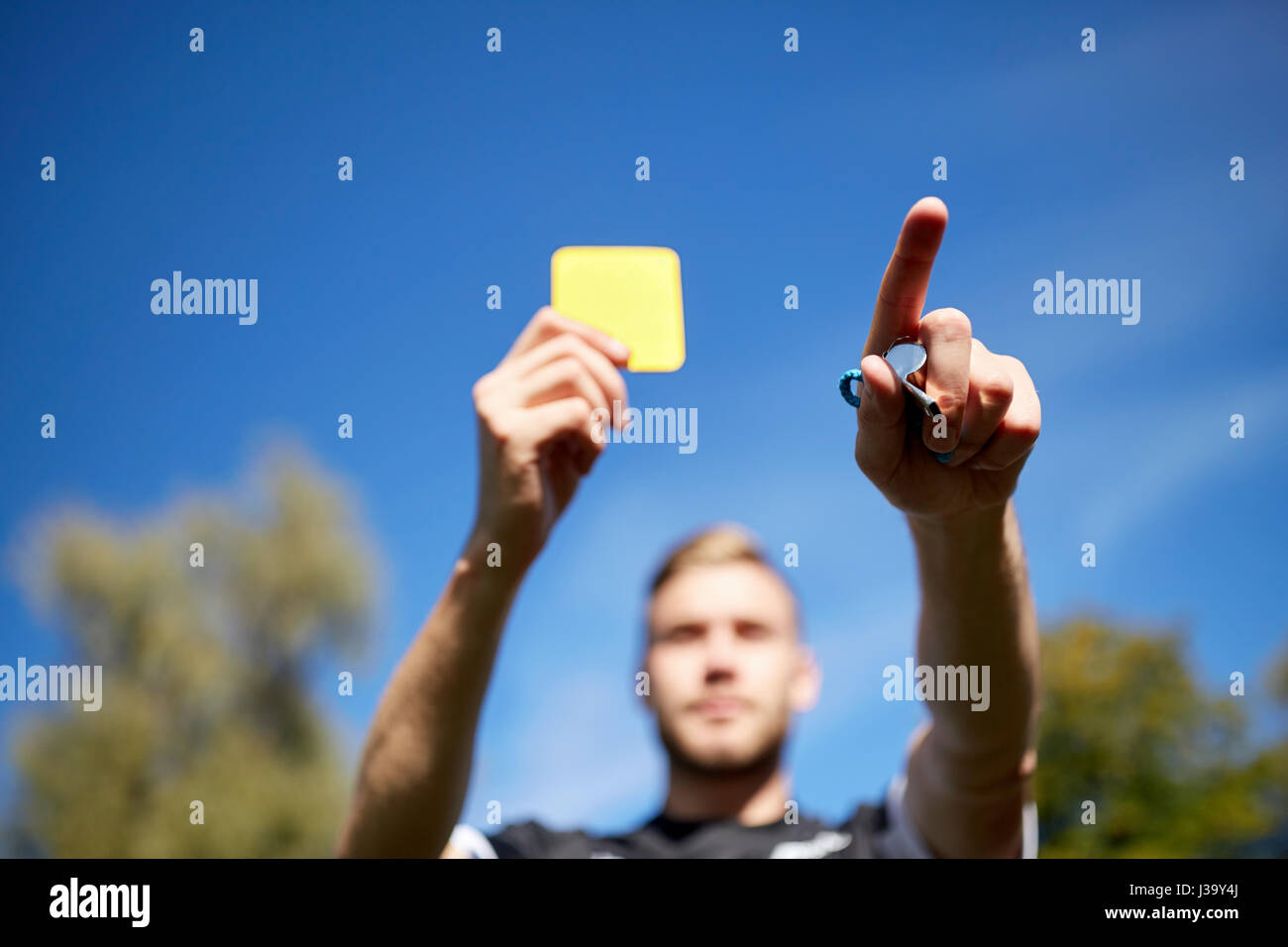 Referee yellow card whistle hi-res stock photography and images - Alamy