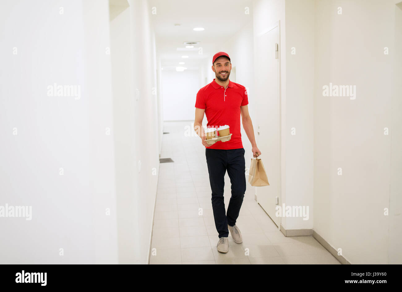 man delivering coffee and food to customer home Stock Photo - Alamy