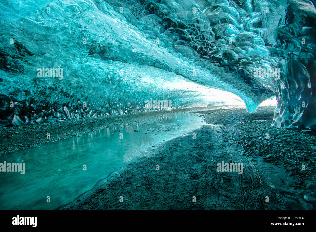 Ice cave below a glacier in Iceland Stock Photo - Alamy