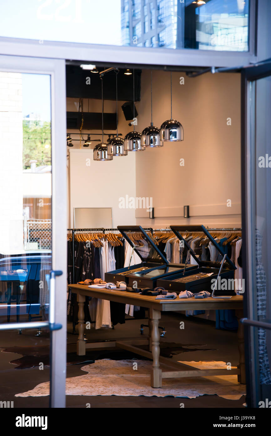Interior of small retail stores with an open door and a number of shiny ...