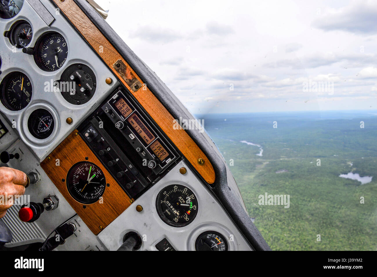 Sitting inside of a small airplane looking outside and turning right ...