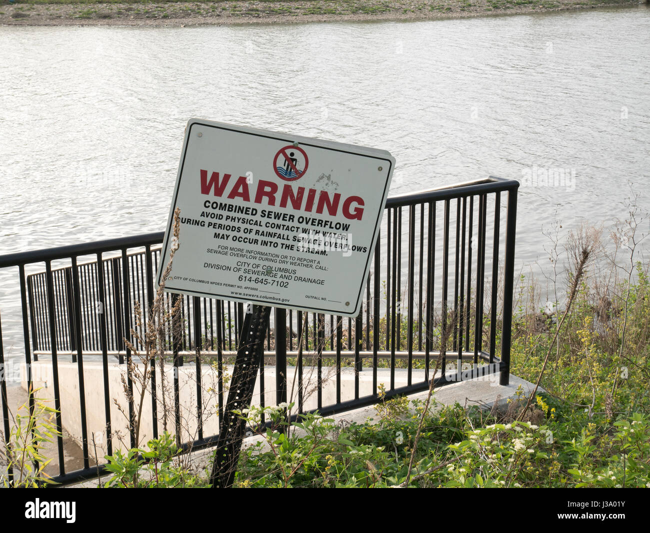Water pollution warning on storm sewer overflow. Scioto River, Columbus ...
