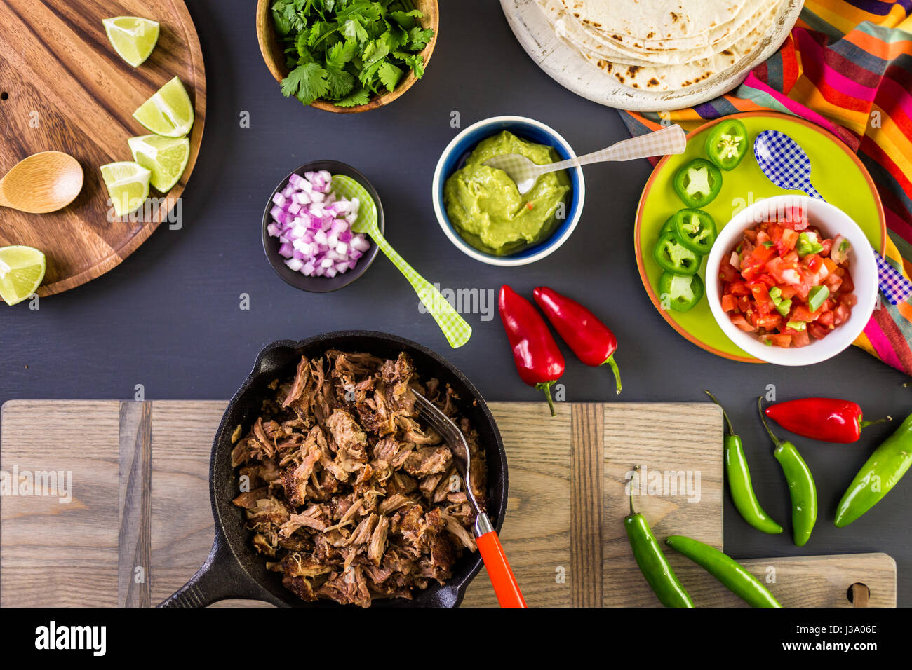 Pulled pork carnitas with pico de gallo on a flour tortilla Stock Photo ...