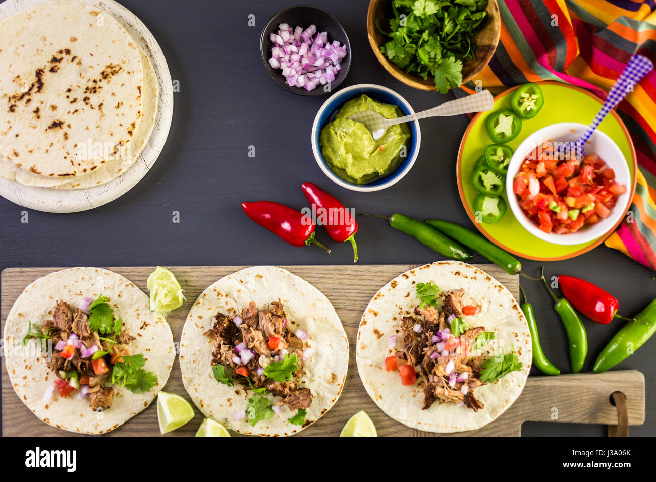 Pulled pork carnitas with pico de gallo on a flour tortilla Stock Photo ...