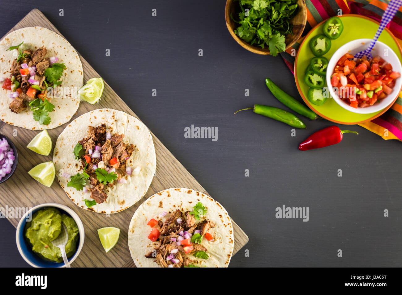 Pulled pork carnitas with pico de gallo on a flour tortilla Stock Photo ...