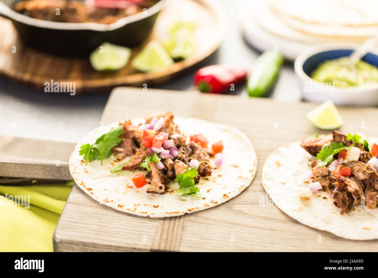 Pulled pork carnitas with pico de gallo on a flour tortilla Stock Photo ...