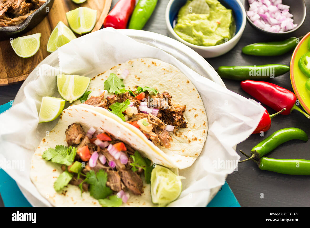Pulled pork carnitas with pico de gallo on a flour tortilla Stock Photo ...