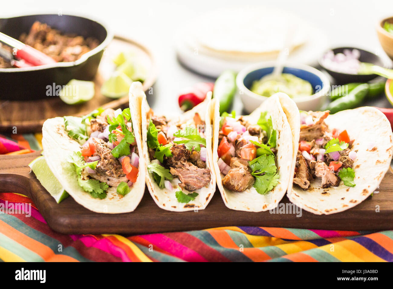 Pulled pork carnitas with pico de gallo on a flour tortilla Stock Photo ...