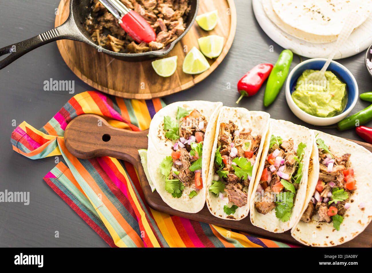 Pulled pork carnitas with pico de gallo on a flour tortilla Stock Photo ...