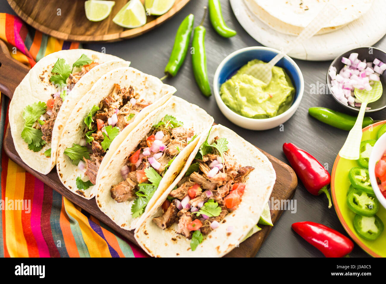 Pulled pork carnitas with pico de gallo on a flour tortilla Stock Photo ...
