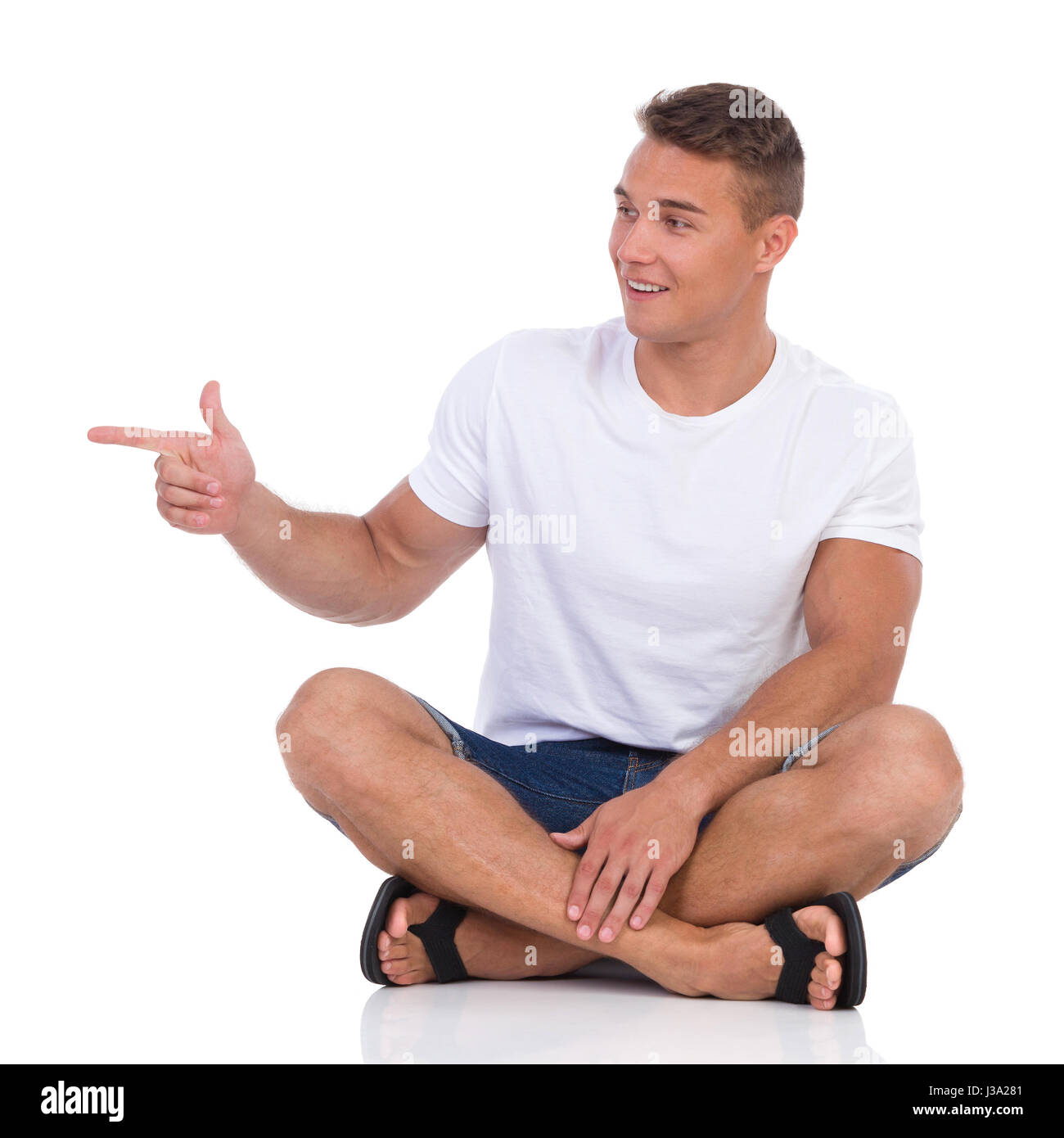 Man full length sitting on floor legs hi-res stock photography and ...