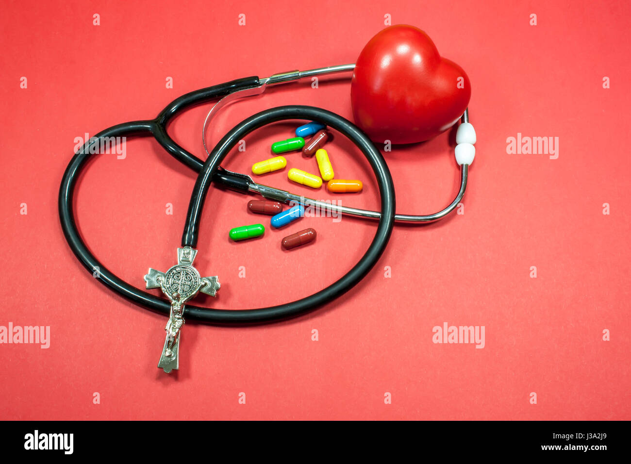 Medical stethoscope having at one end a Christian cross or crucifix ...