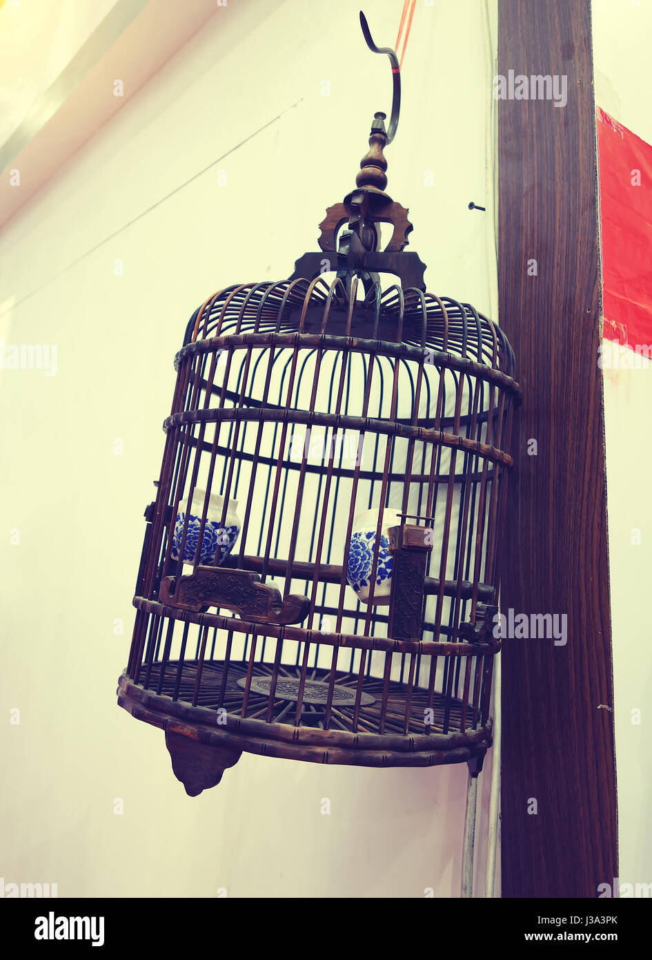 Birdcage hanging on Stock Photo - Alamy