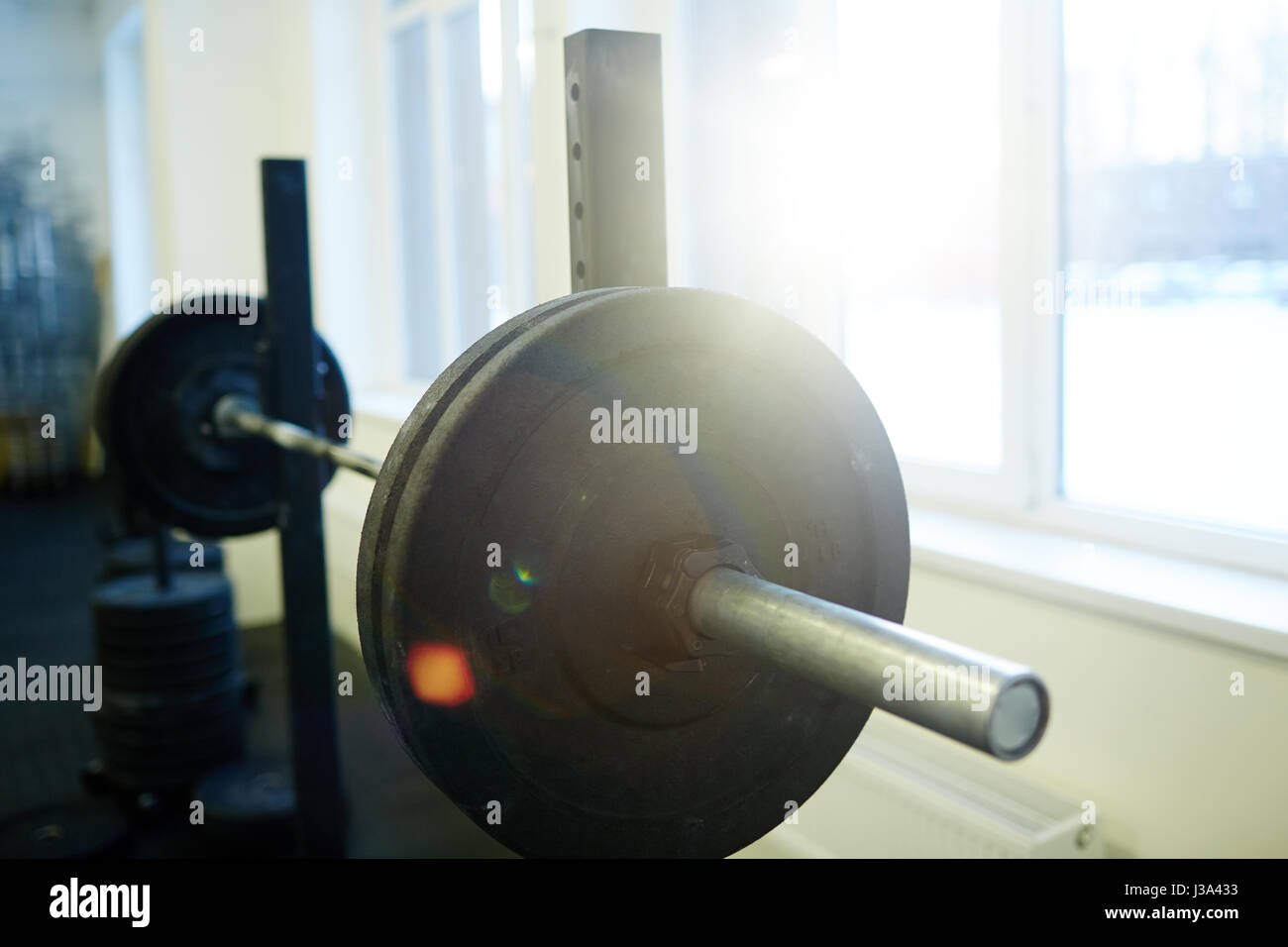 Heavy Barbell in Sunlight Stock Photo - Alamy