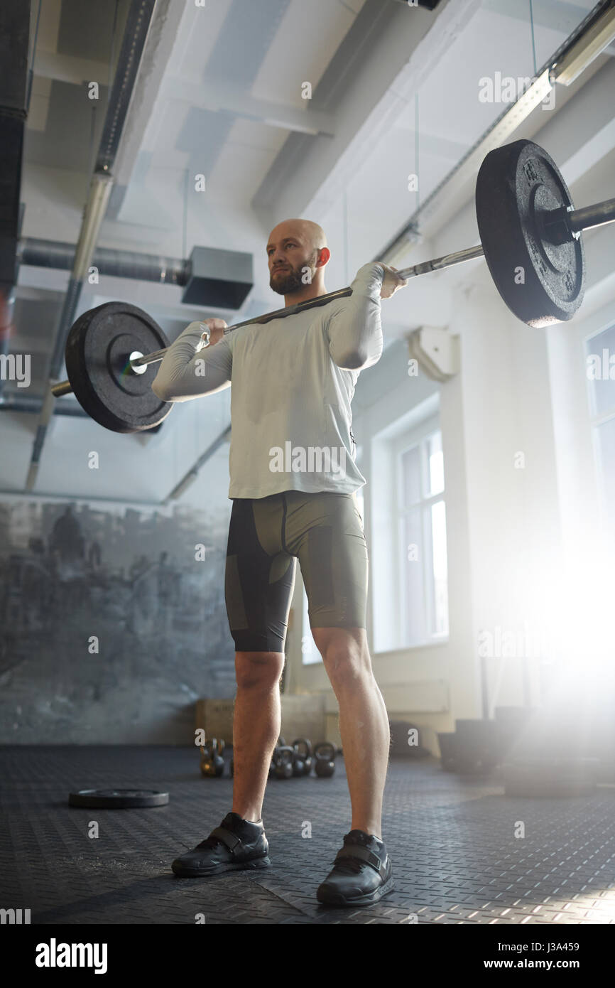 Modern Strongman Lifting Barbell in Gym Stock Photo - Alamy