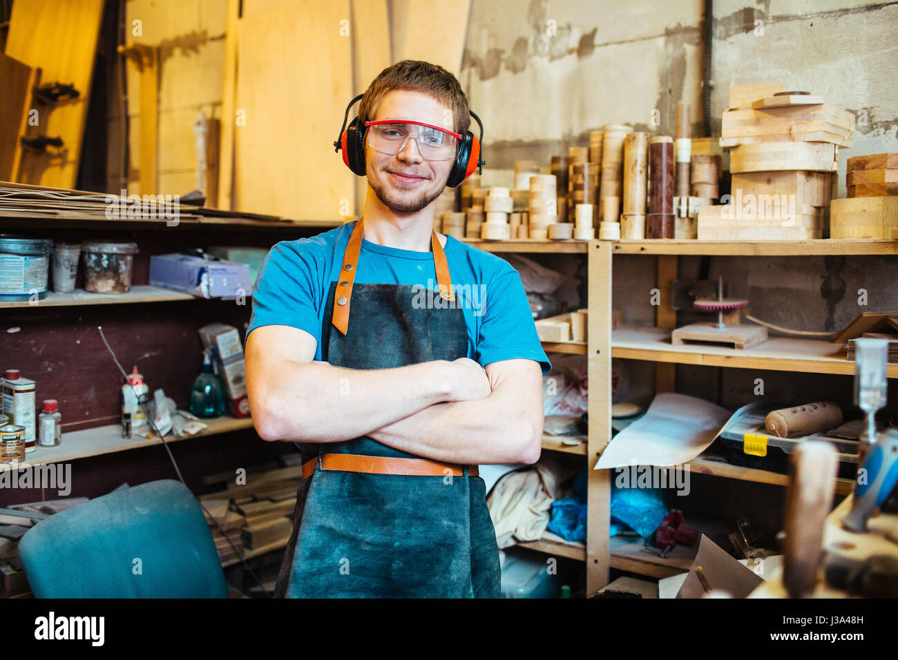 Smiling Craftsman in Carpenting Studio Stock Photo - Alamy
