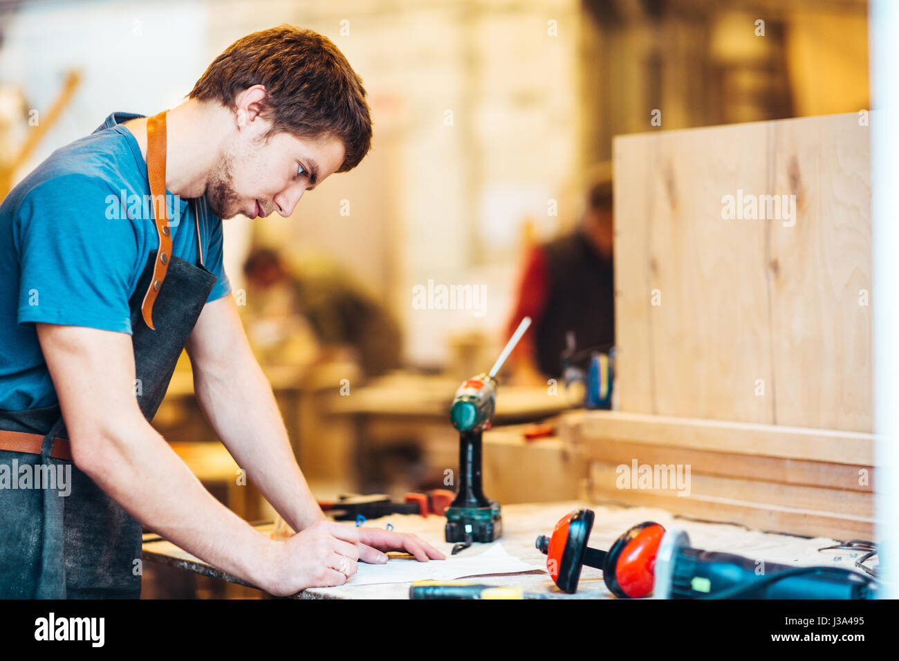 Carpenter at Workstation in Shop Stock Photo - Alamy