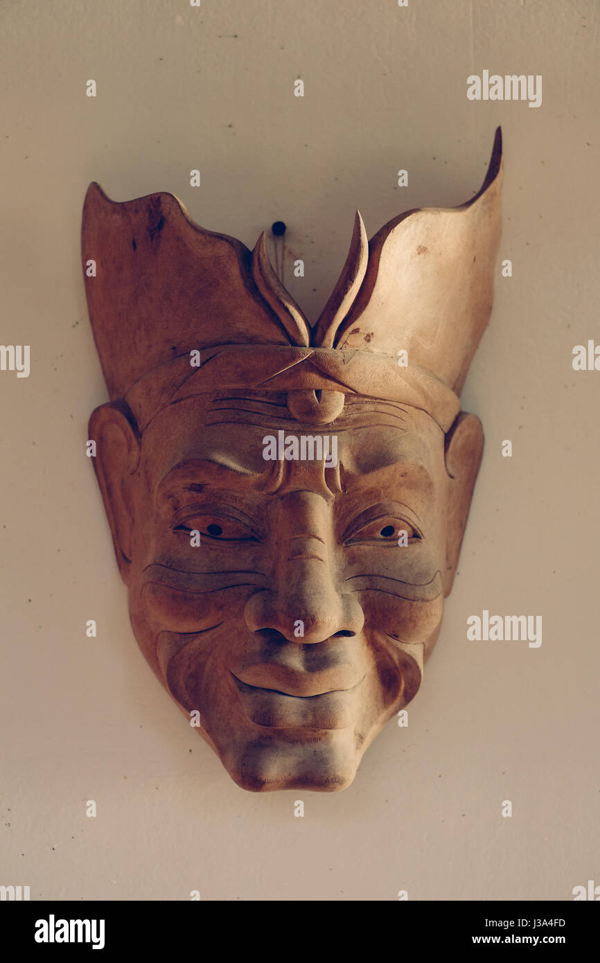 Filipino hand made, wooden tribal mask on the wall Stock Photo - Alamy