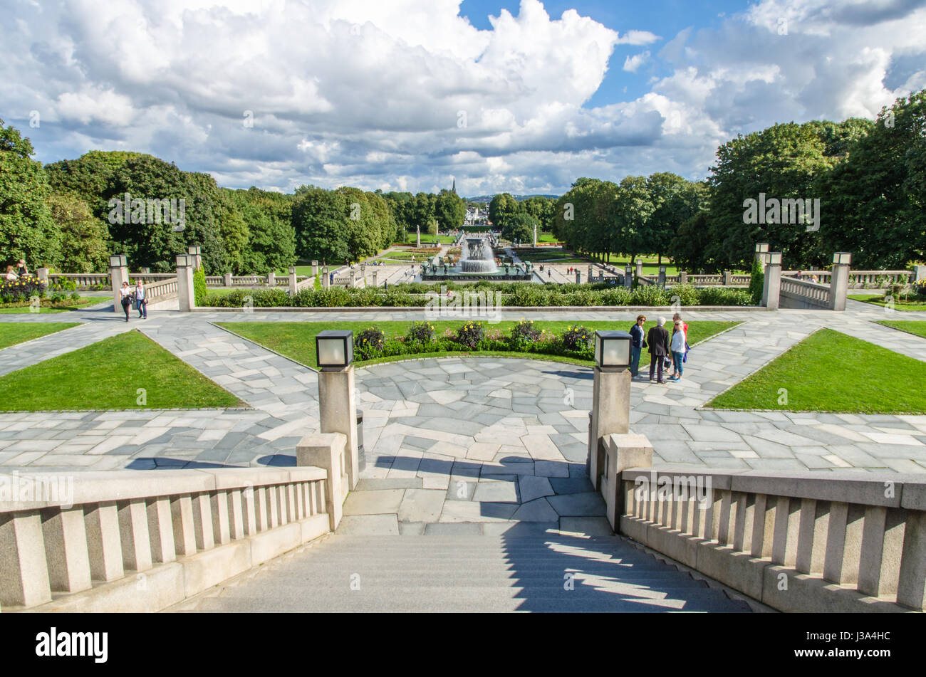 Tourists walk around Vigeland Sculpture Park, or Frogner Park, designed ...