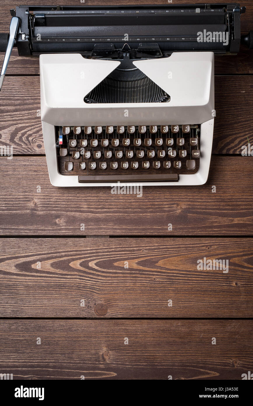 Old typewriter on wooden table. Top view Stock Photo - Alamy