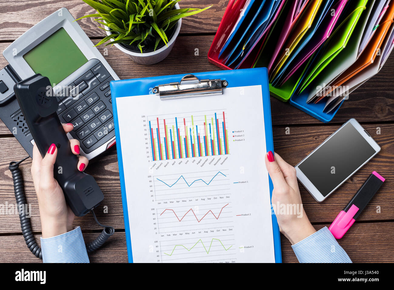 Office desktop with graphs and charts, documents and modern digital ...