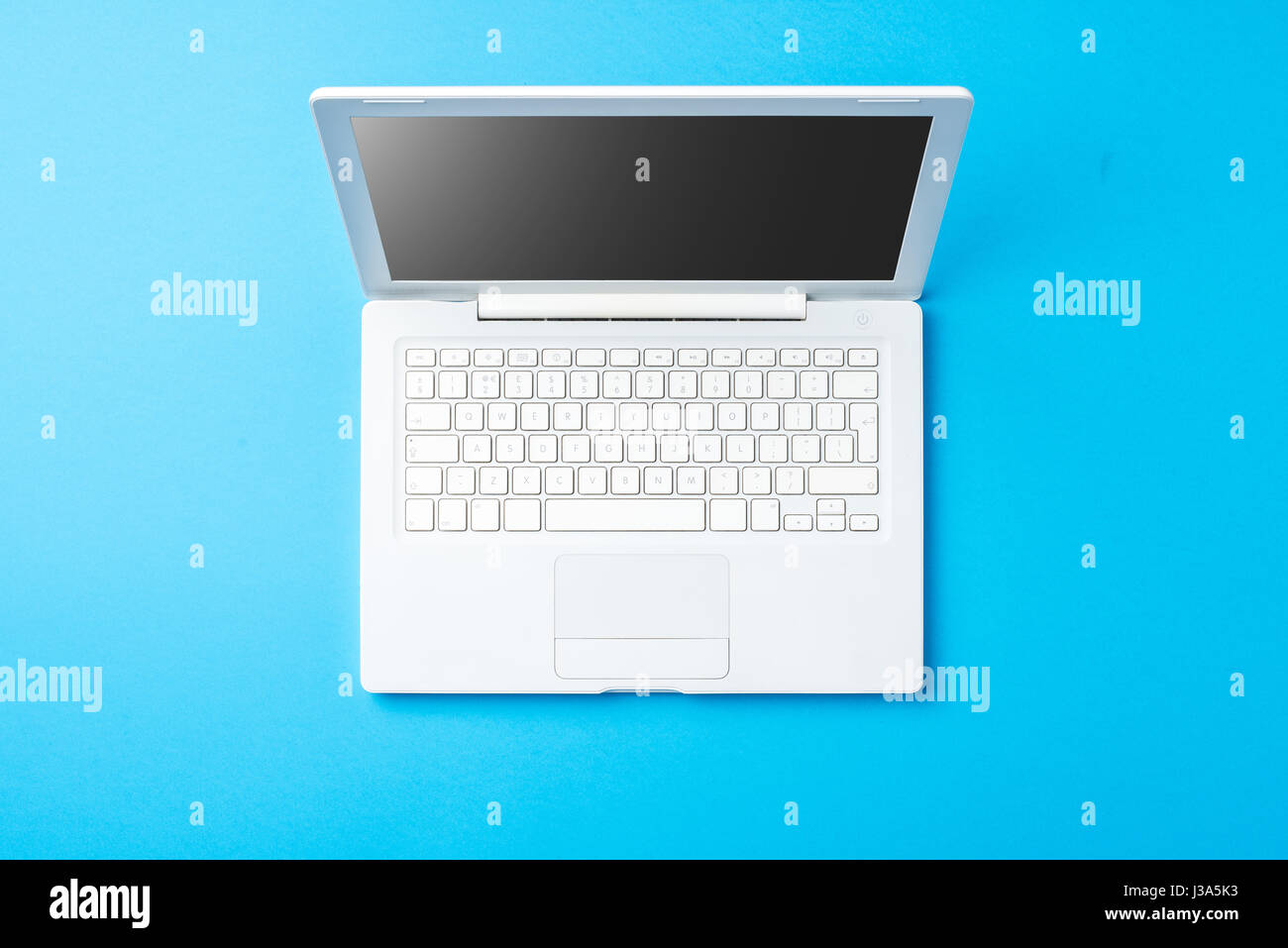 Modern computer on blue background Stock Photo - Alamy
