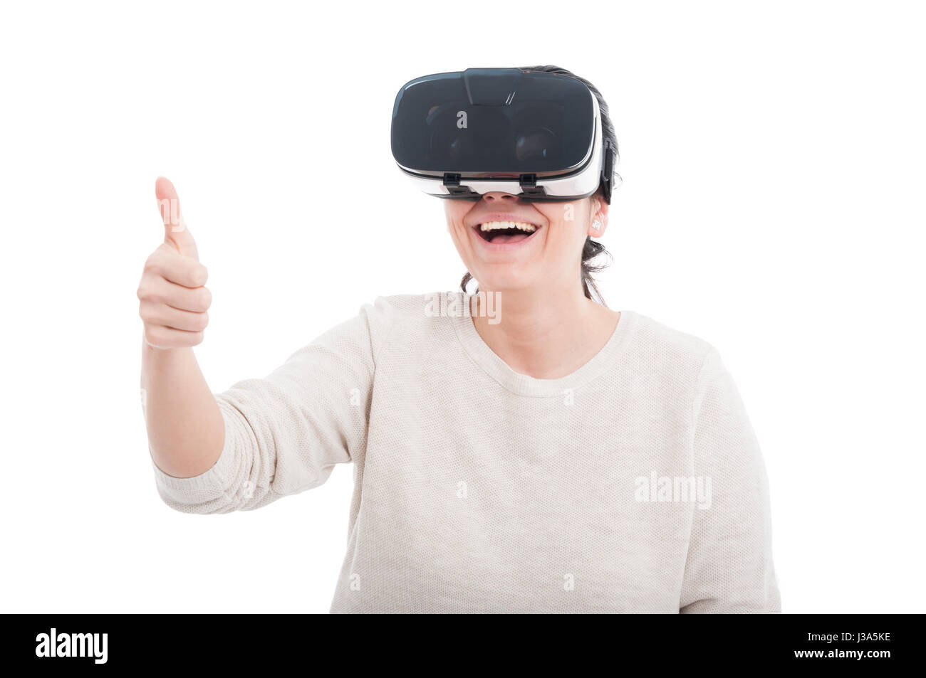 Joyful funny female showing thumb up and experiencing virtual reality ...