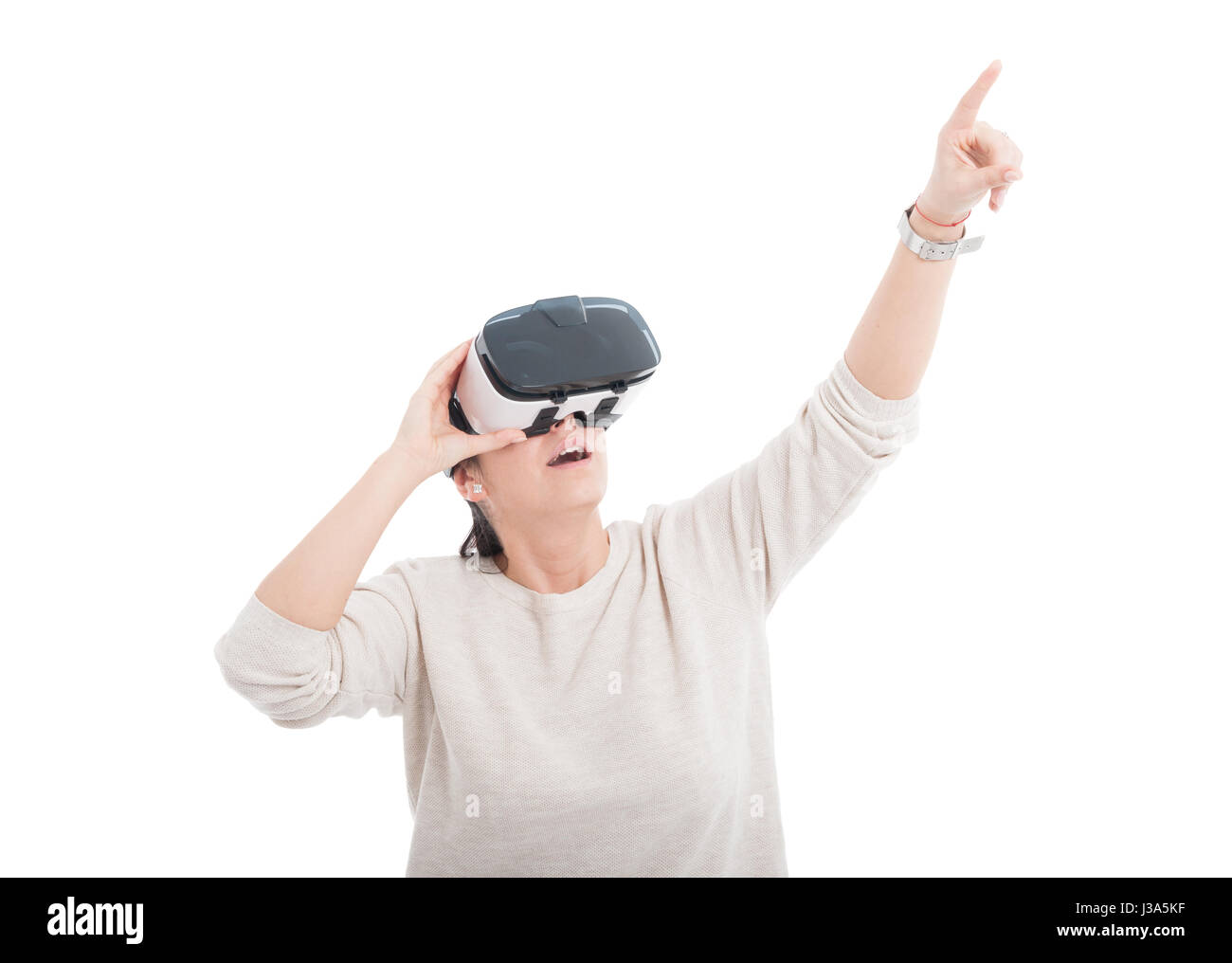 Woman experience world of gaming by using VR headset and pointing ...