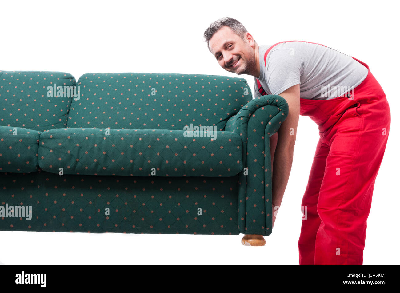 Mover guy holding up couch while moving and smiling isolated on white ...