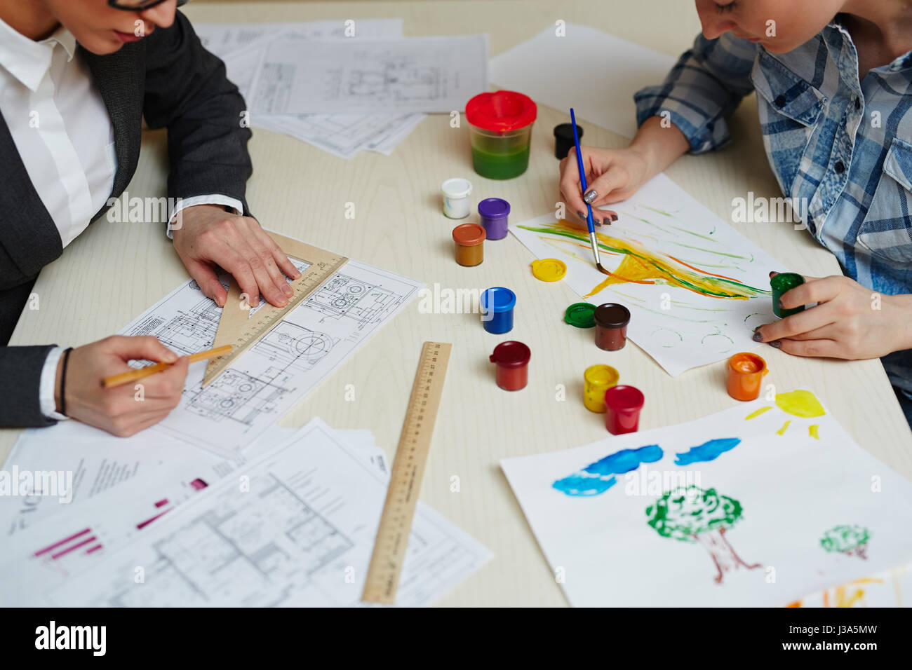 Left-brain and right-brain women at work Stock Photo - Alamy
