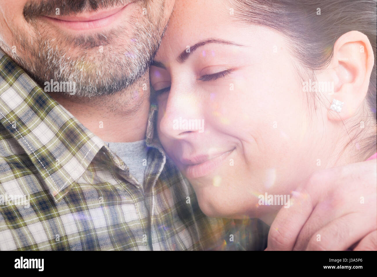Closeup portrait of beautiful woman hugging her boyfriend isolated on white background Stock ...