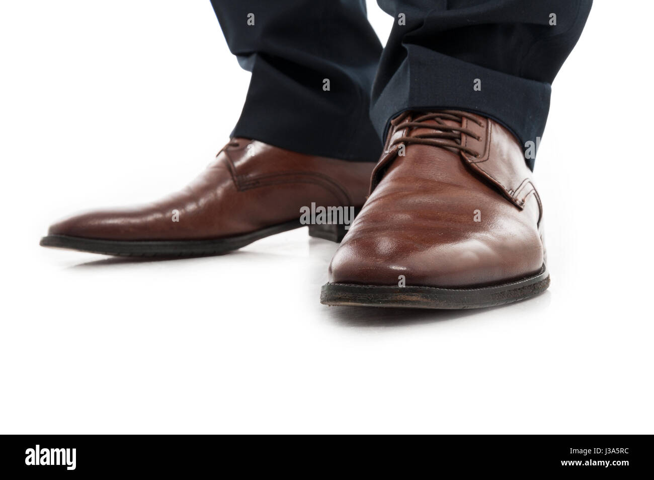 Close-up of leather elegant man shoes standing still isolated on white ...