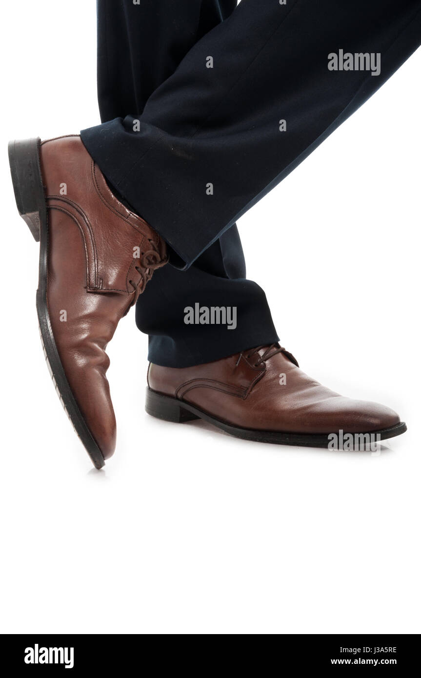 Close-up of side view leather brown elegant man shoes posing relaxed ...