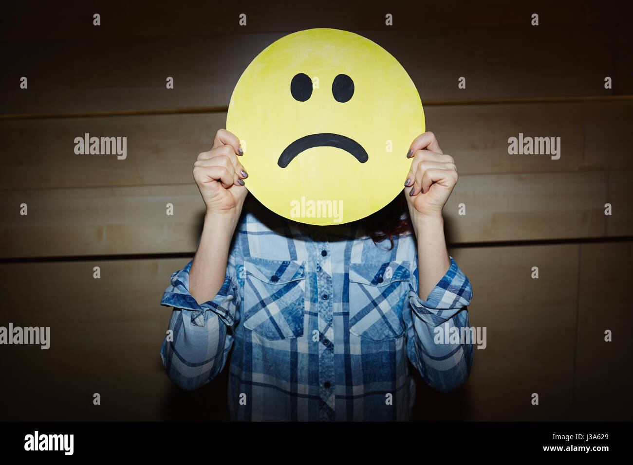 Posing for Photography with Sad Mask Stock Photo - Alamy
